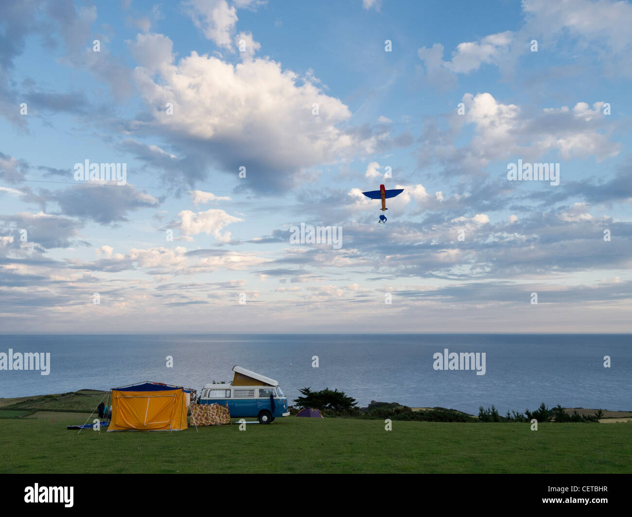 Kite flying on camping field in beautiful blue sky at the seaside Stock ...