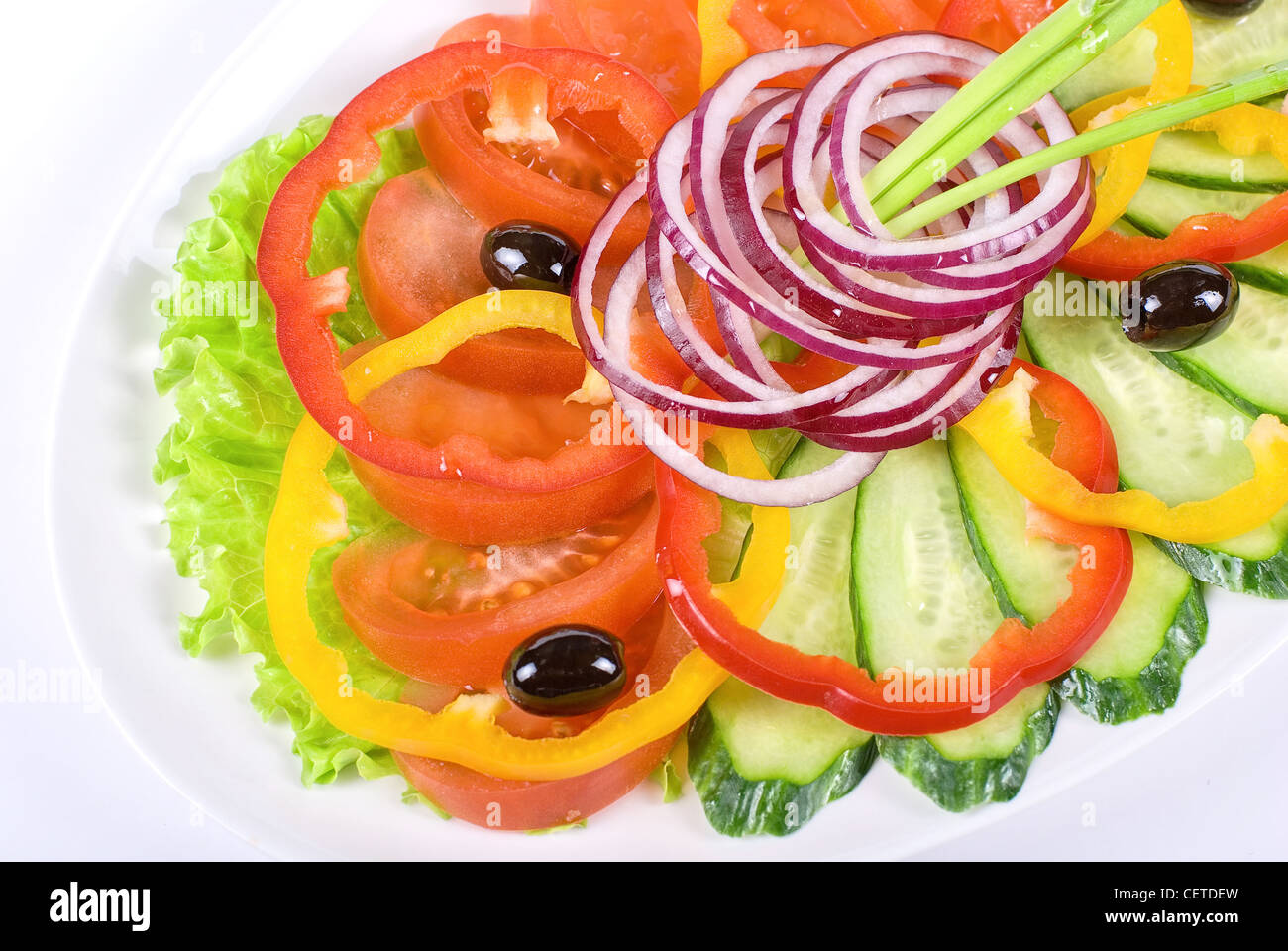 sliced vegetables at the dish isolated on a white Stock Photo - Alamy