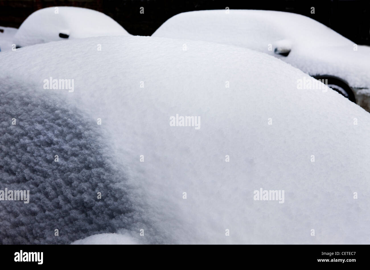 London streets and cars covered in snow after a blizzard in February ...