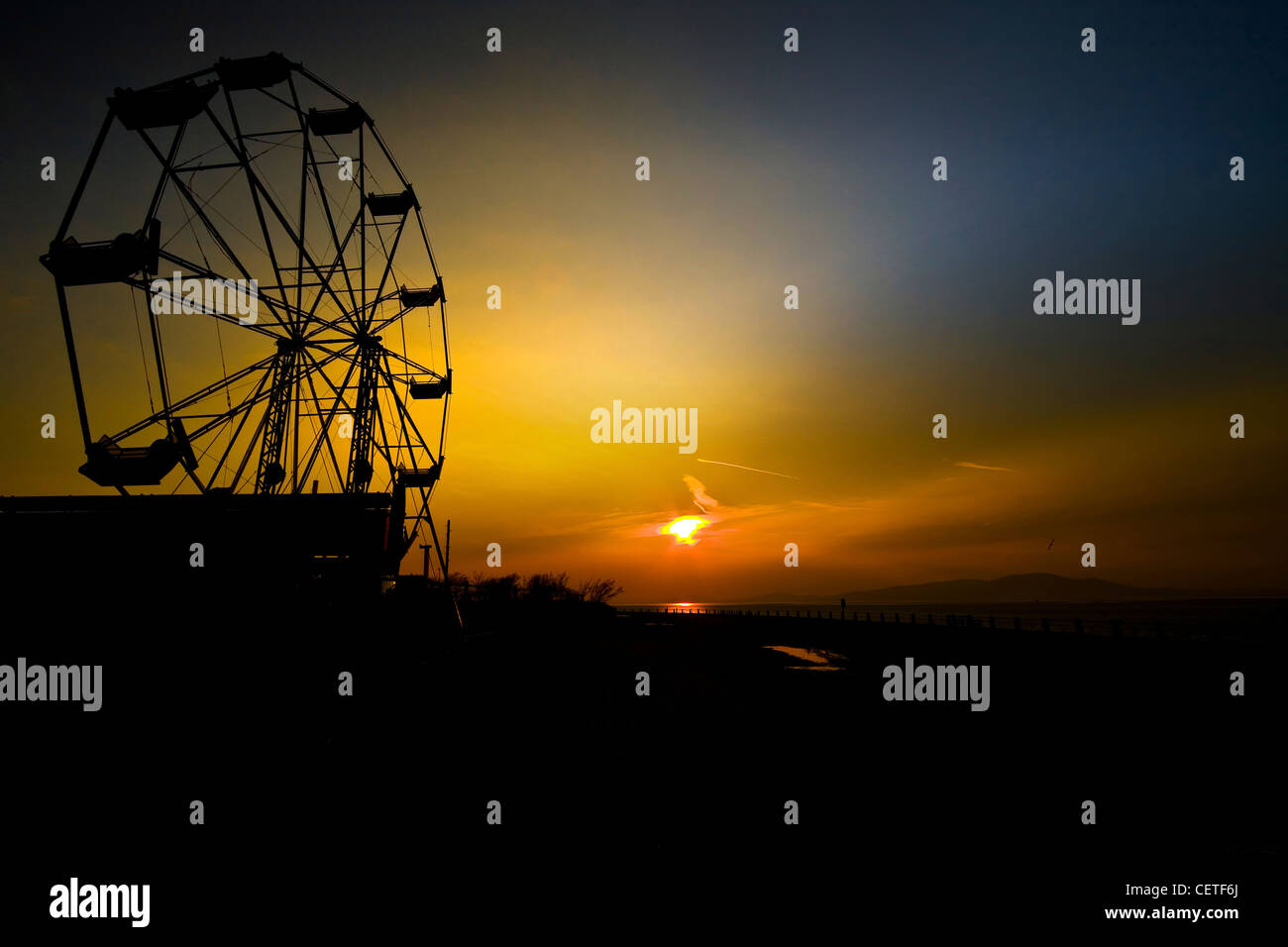 A silhouette of a ferris wheel at sunset in Silloth Stock Photo - Alamy