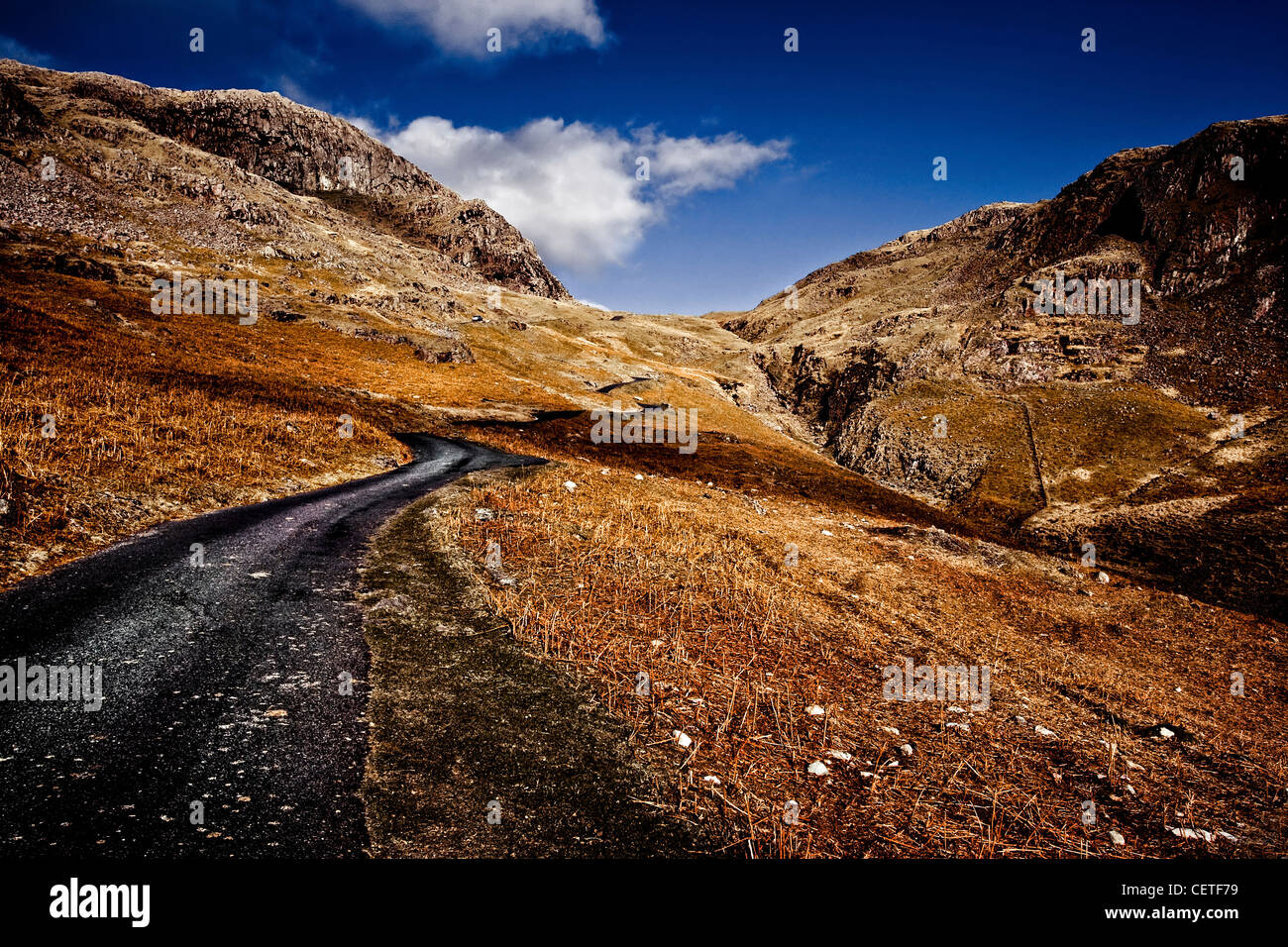 A view of mountains and a twisting road In Cumbria Stock Photo - Alamy