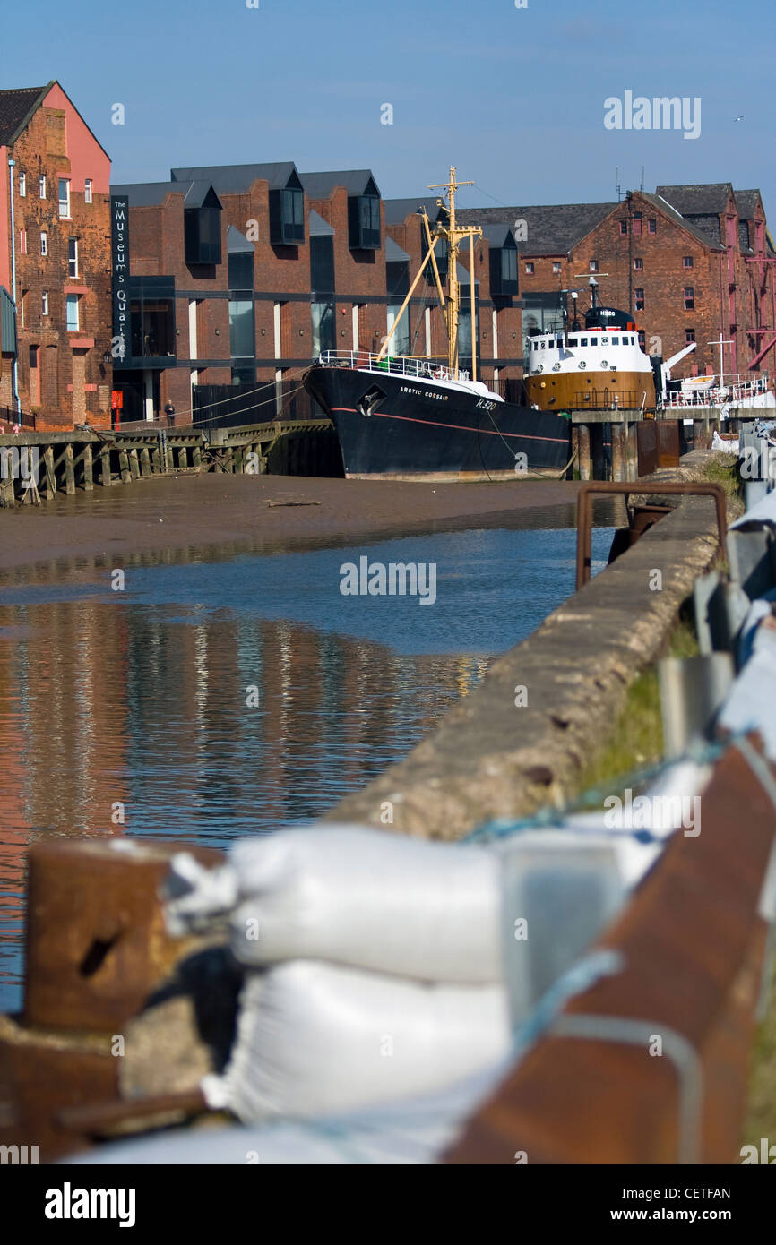A view of riverside buildings and moored boats at Kingston Upon Hull ...