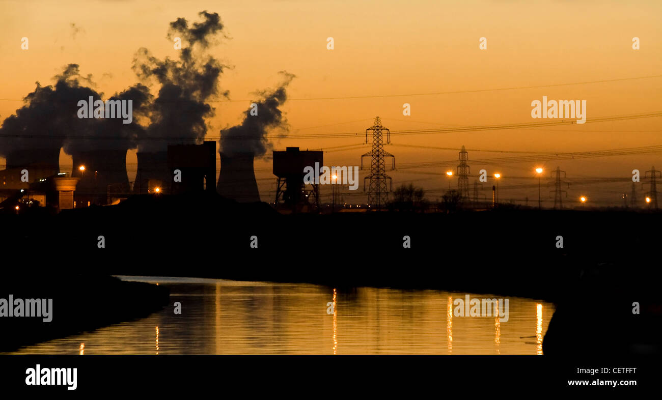 A dusk view across the river to smoke rising from industrial chimneys ...