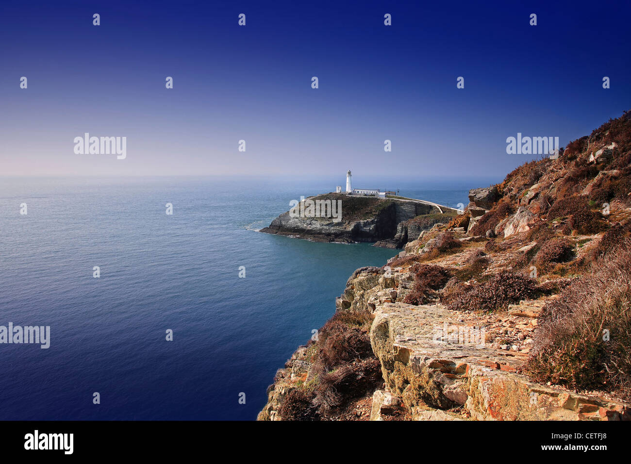 A view from the cliff top to South Stack Lighthouse at Holyhead Stock ...
