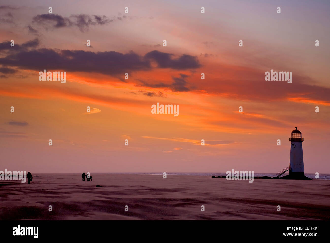 A view from a windswept beach to Talacre Lighthouse at sunset Stock ...