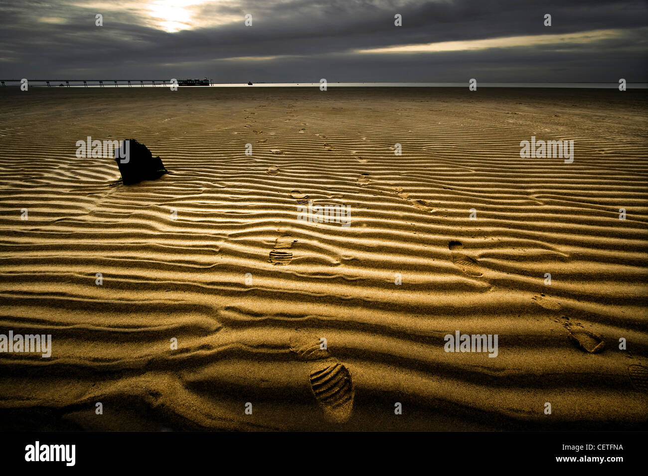 A view over a windswept beach to Humber Pilots Jetty on the East ...