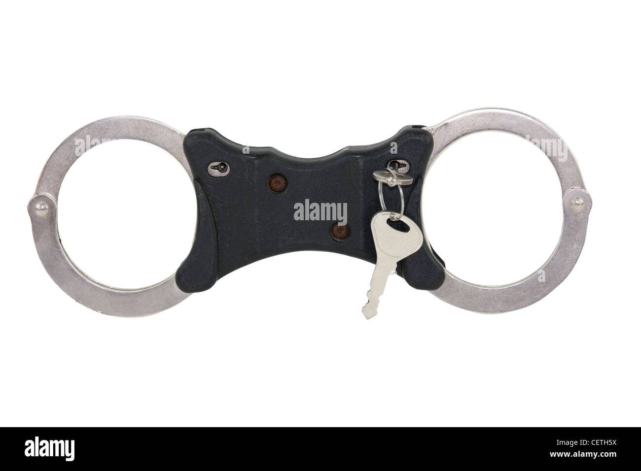 handcuffs closed with the key in the lock on white Stock Photo - Alamy