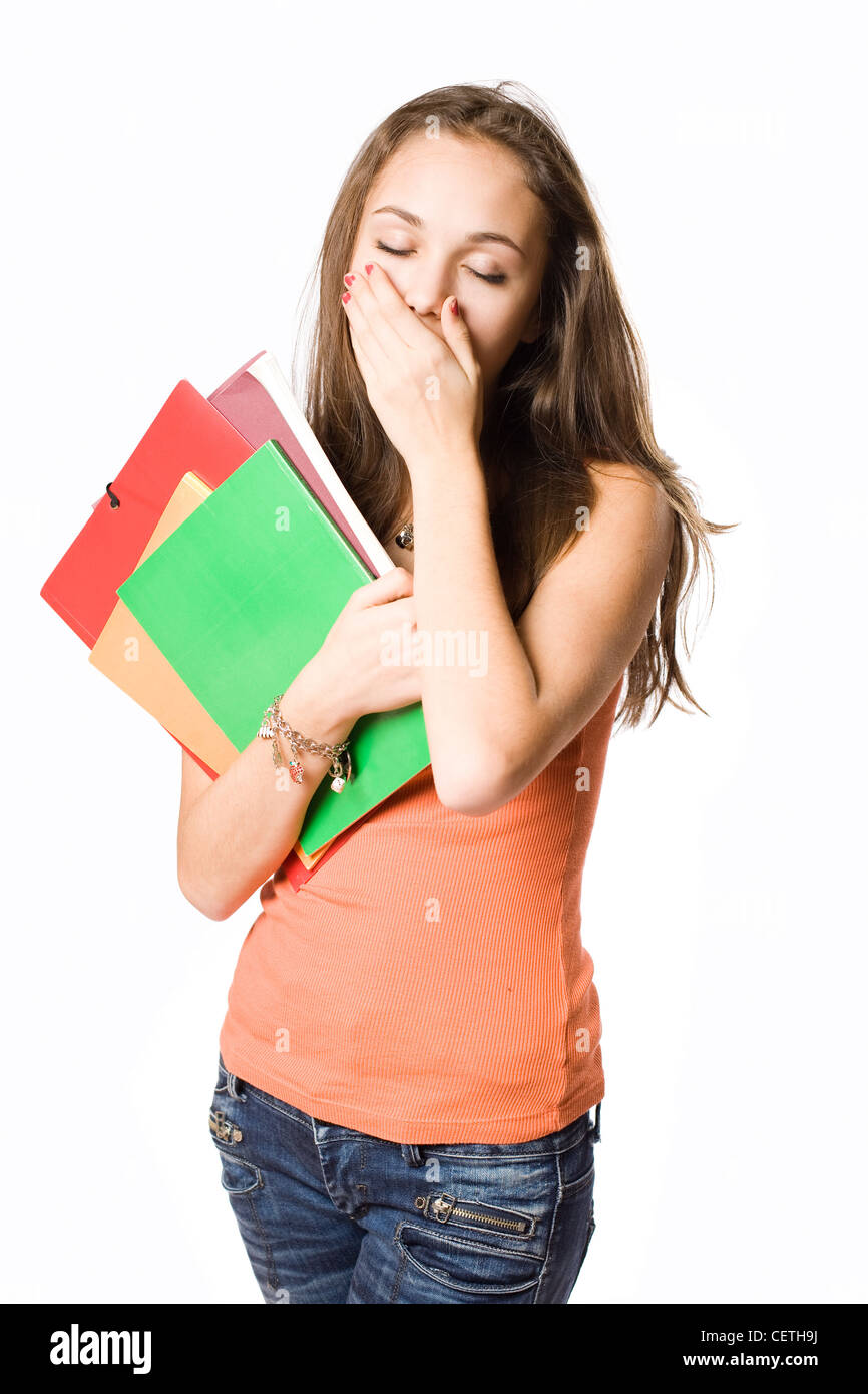 Portrait of a cute young student girl bored, yawning Stock Photo - Alamy