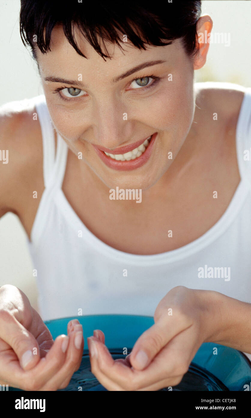 Female wet black hair and short fringe wearing lipgloss natural eye ...