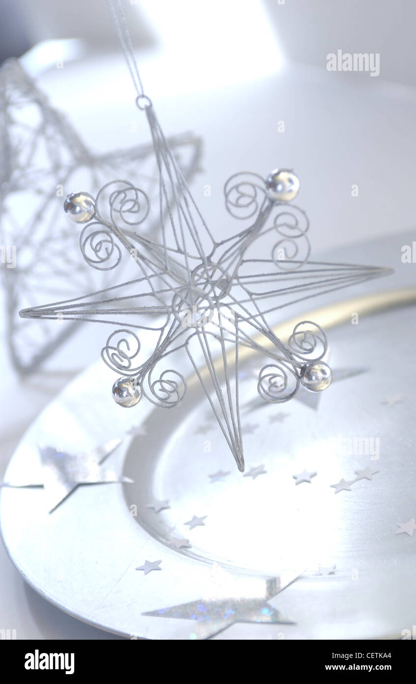 Ornate silver star Christmas decoration made from wire and baubles ...