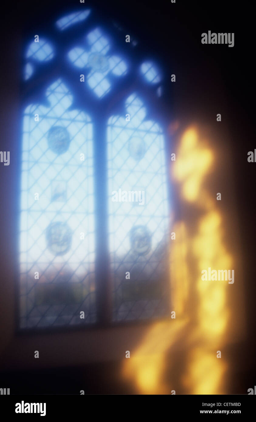 Atmospheric view of diamond leaded 14th century Decorated Gothic window ...