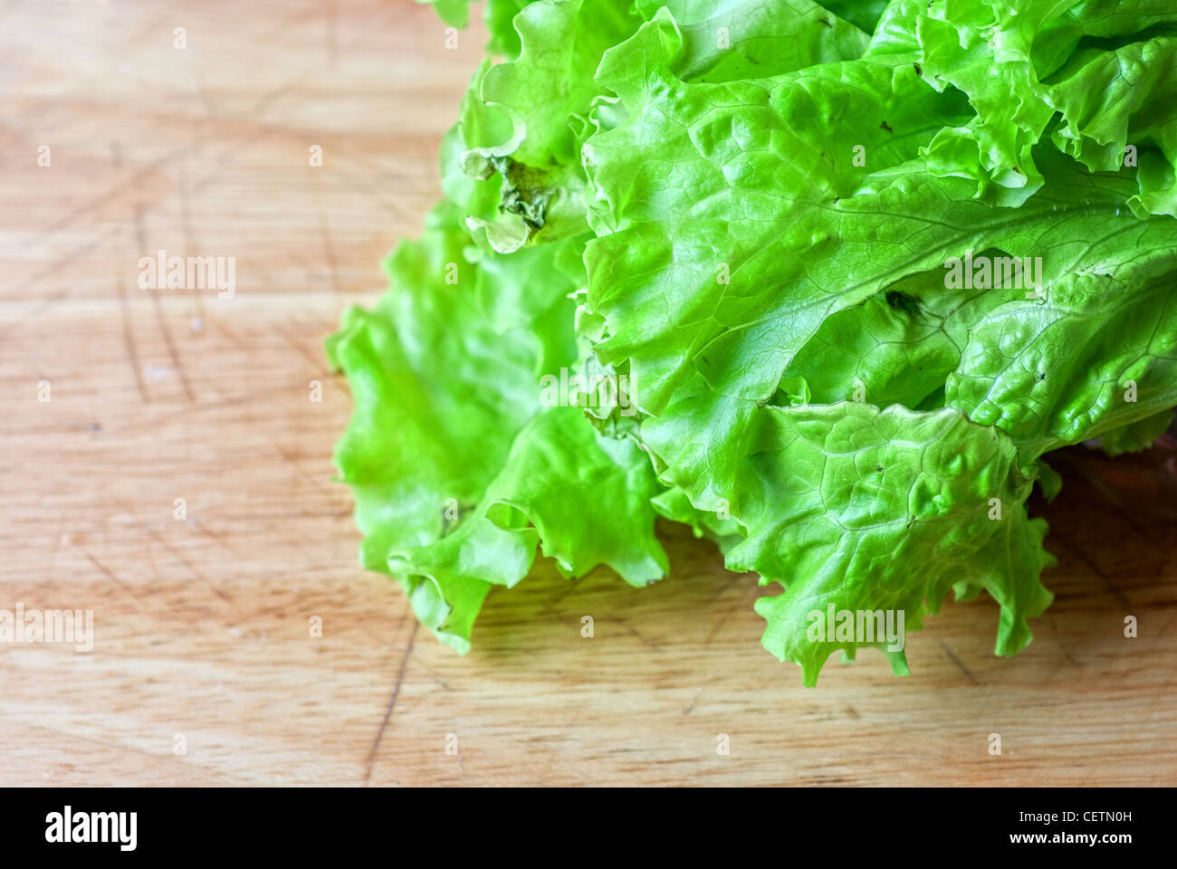 ripe lettuce on the wood table Stock Photo - Alamy