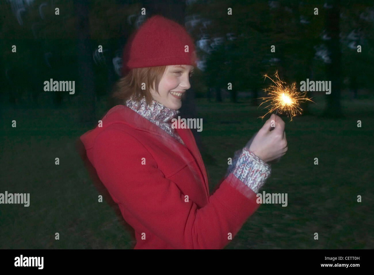 Female shoulder length red hair wearing red wool hat, multicoloured ...