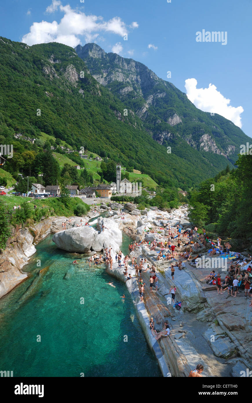 Holidaymakers on the riverside at summer Swiss Alps Stock Photo - Alamy