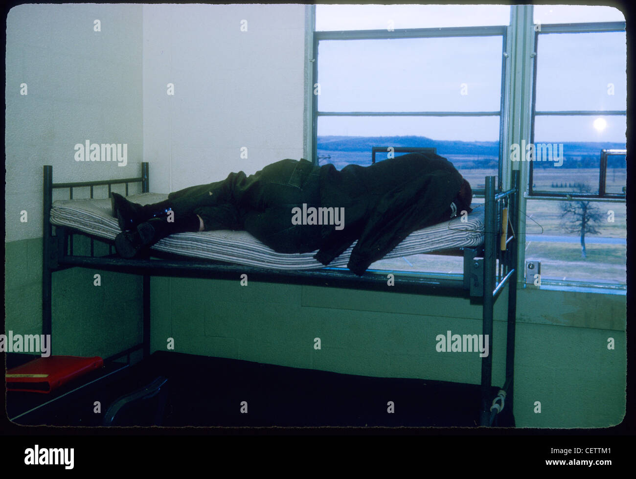 US helicopter pilot in training sleeping on bunk in barracks at Fort ...