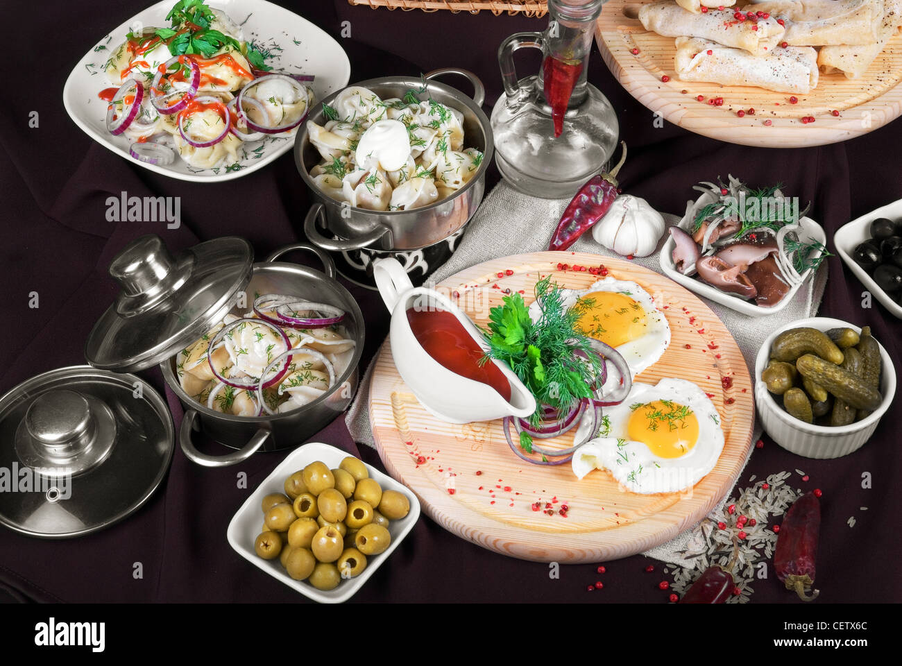 Many food dishes on the restaurant table. close up Stock Photo - Alamy