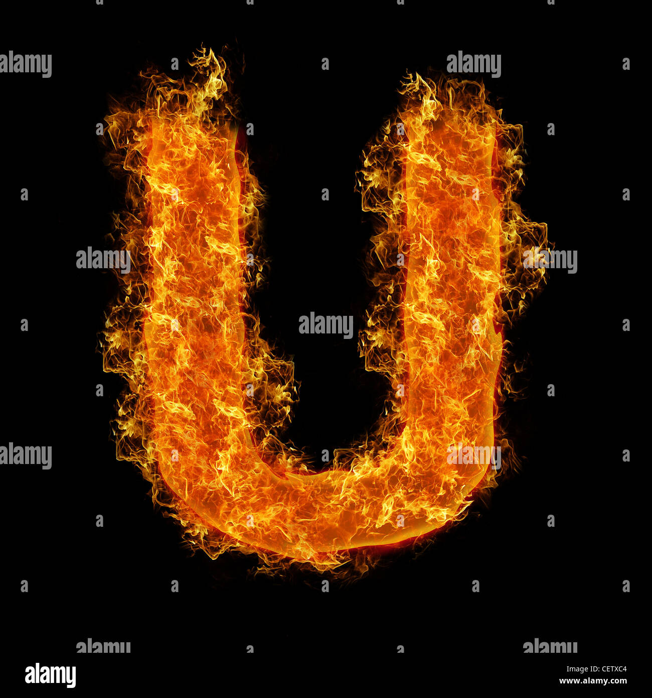 Fire letter U on a black background Stock Photo - Alamy