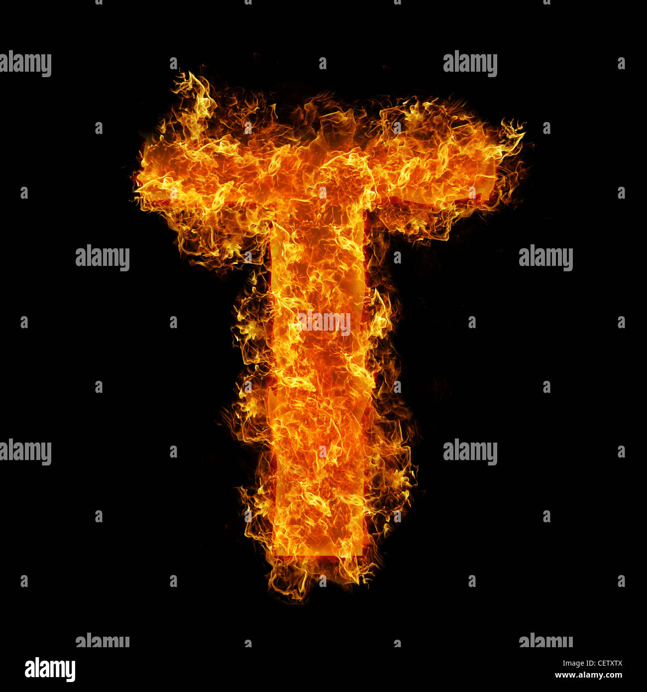 Fire letter T on a black background Stock Photo - Alamy