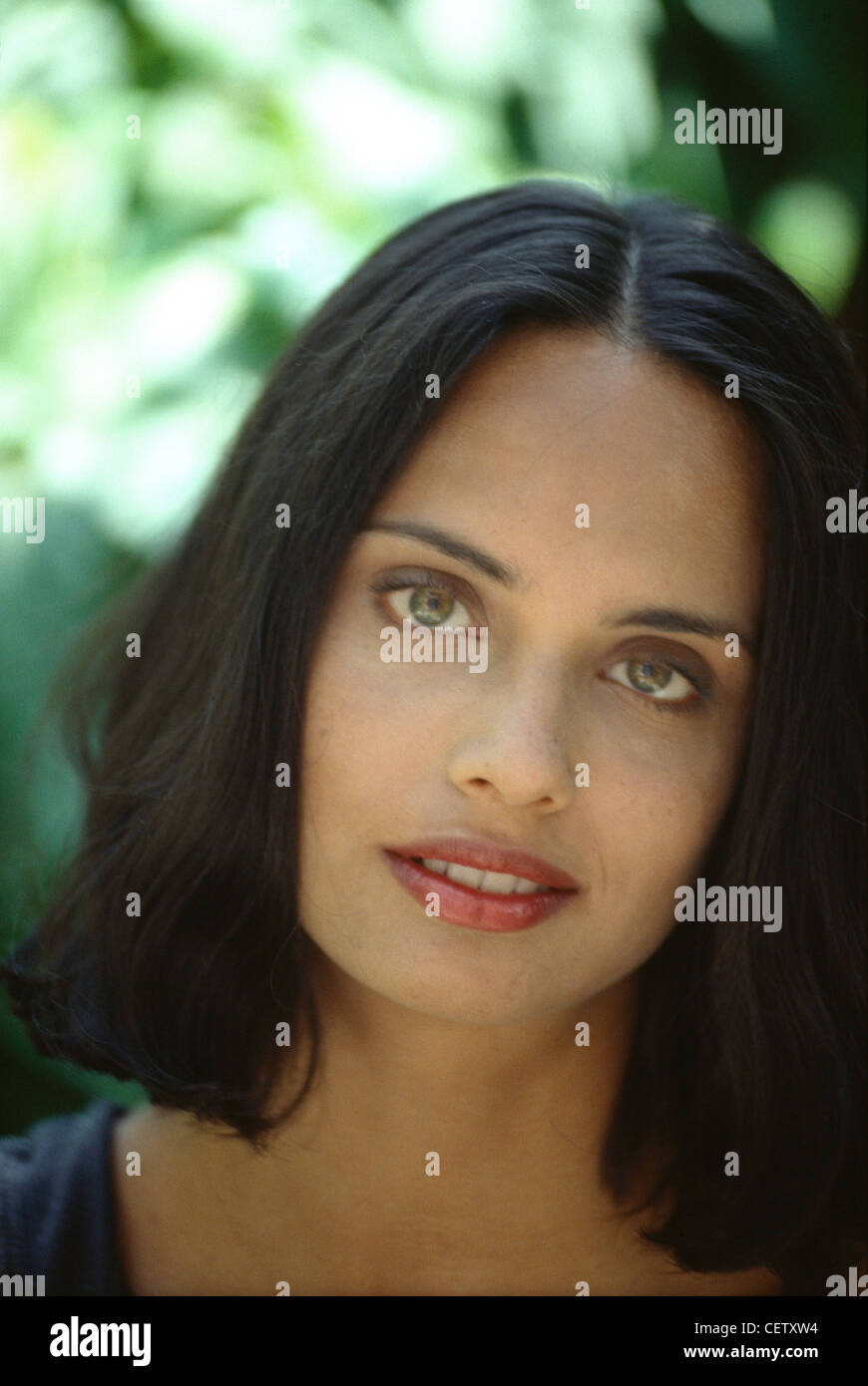 Female straight bobbed brunette hair middle parting head tilted looking ...