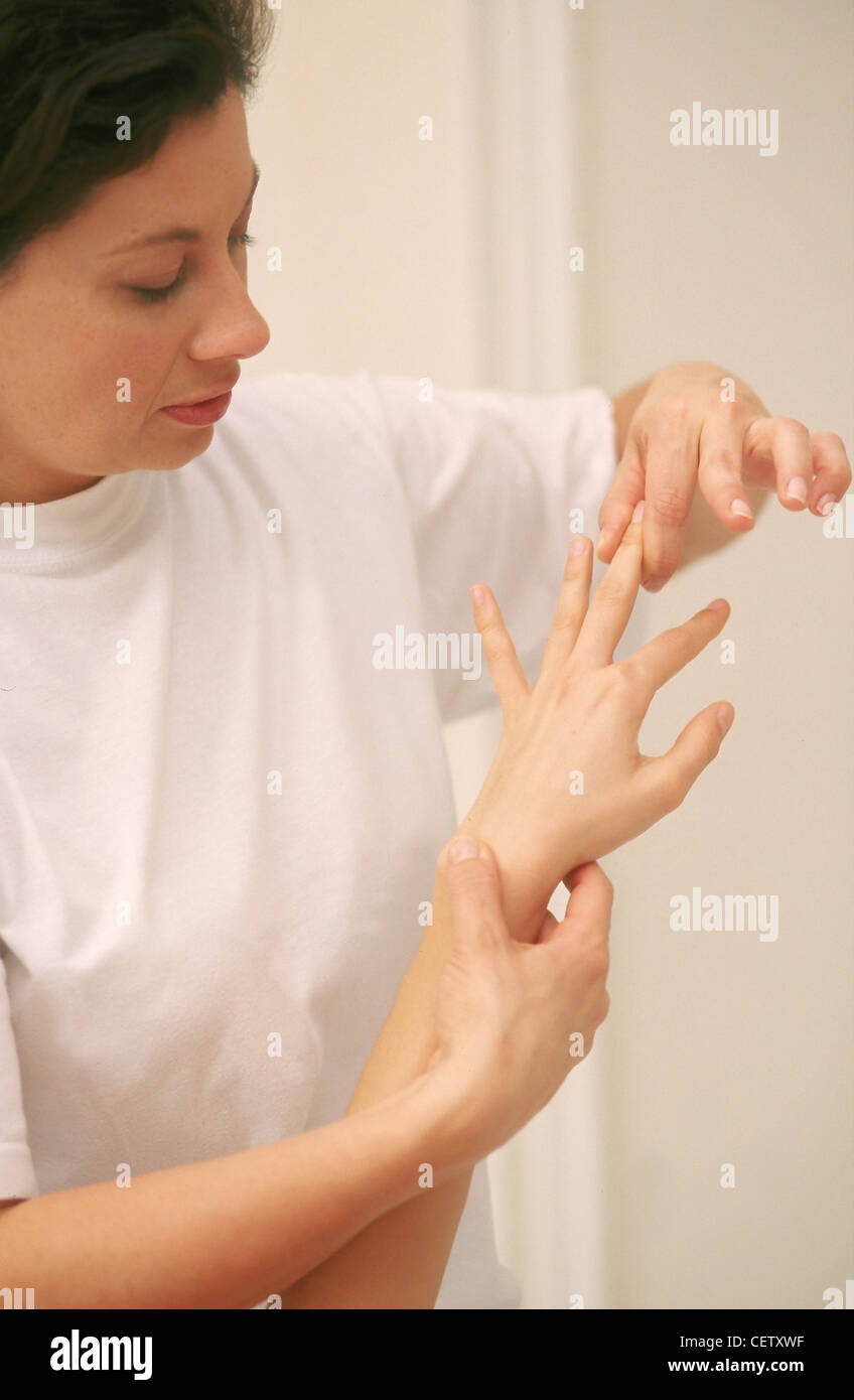Female professional holding Female wrist pulling fingertips Stock Photo ...