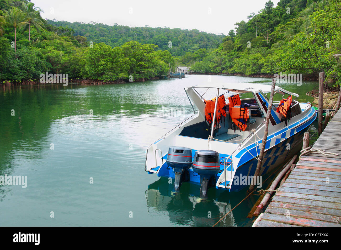 Speedboat at harbour on river Stock Photo - Alamy