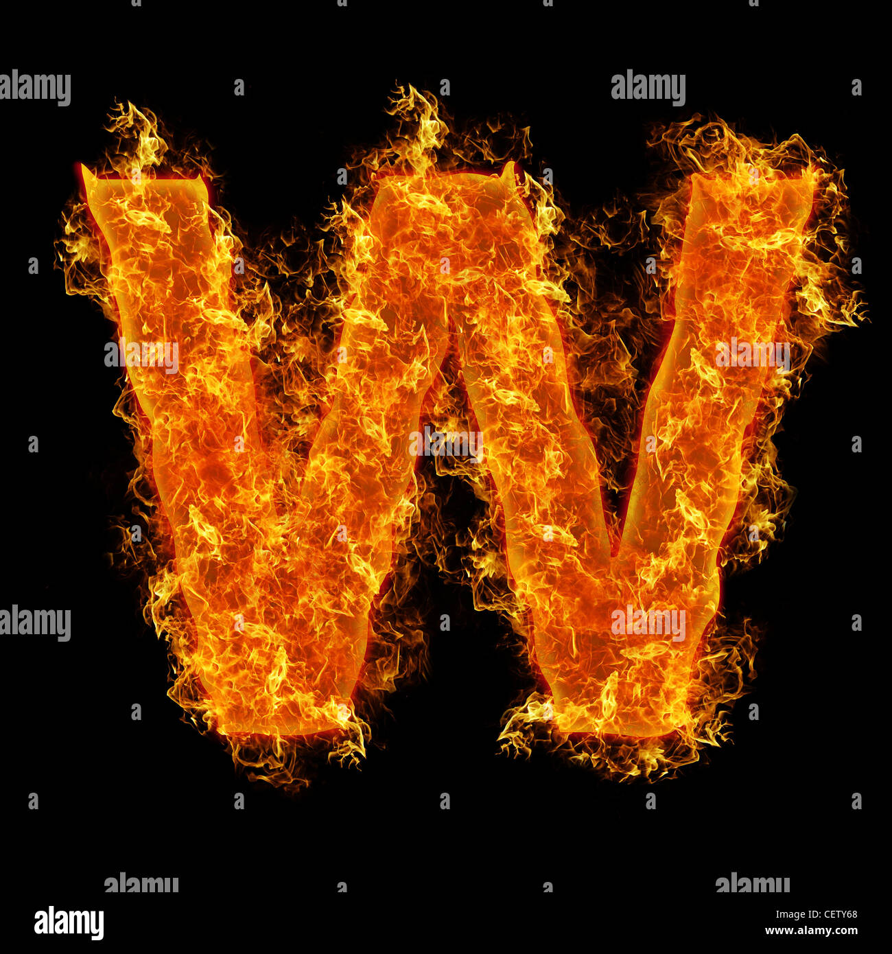 Fire letter W on a black background Stock Photo - Alamy