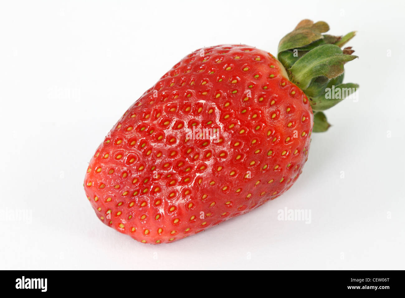 Single whole strawberry on a white background Stock Photo - Alamy