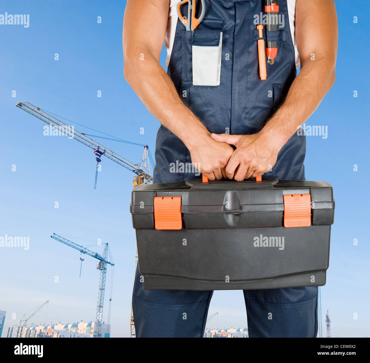 repairman with box of instruments on building background Stock Photo ...