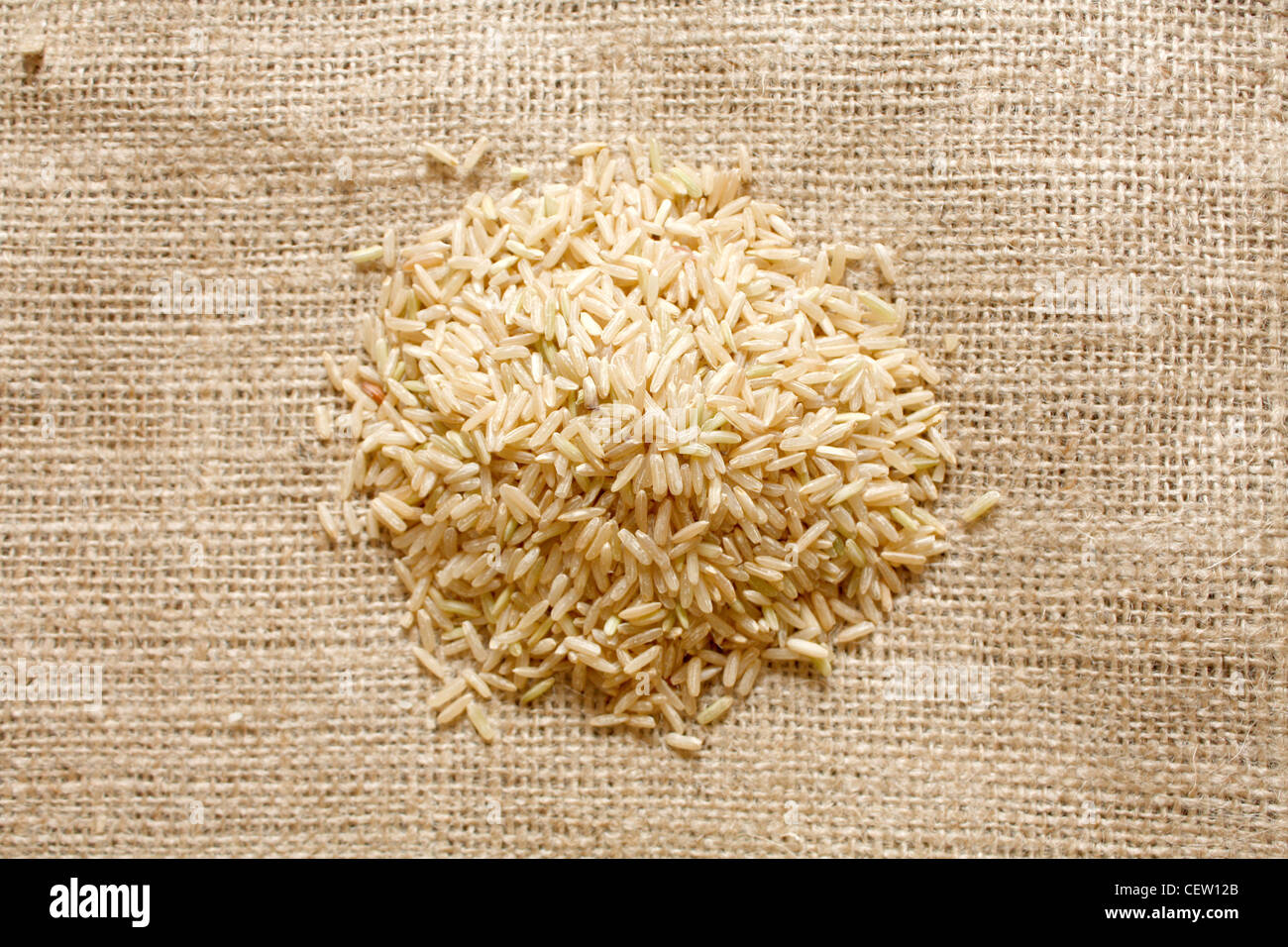 Brown rice on a textile background Stock Photo - Alamy