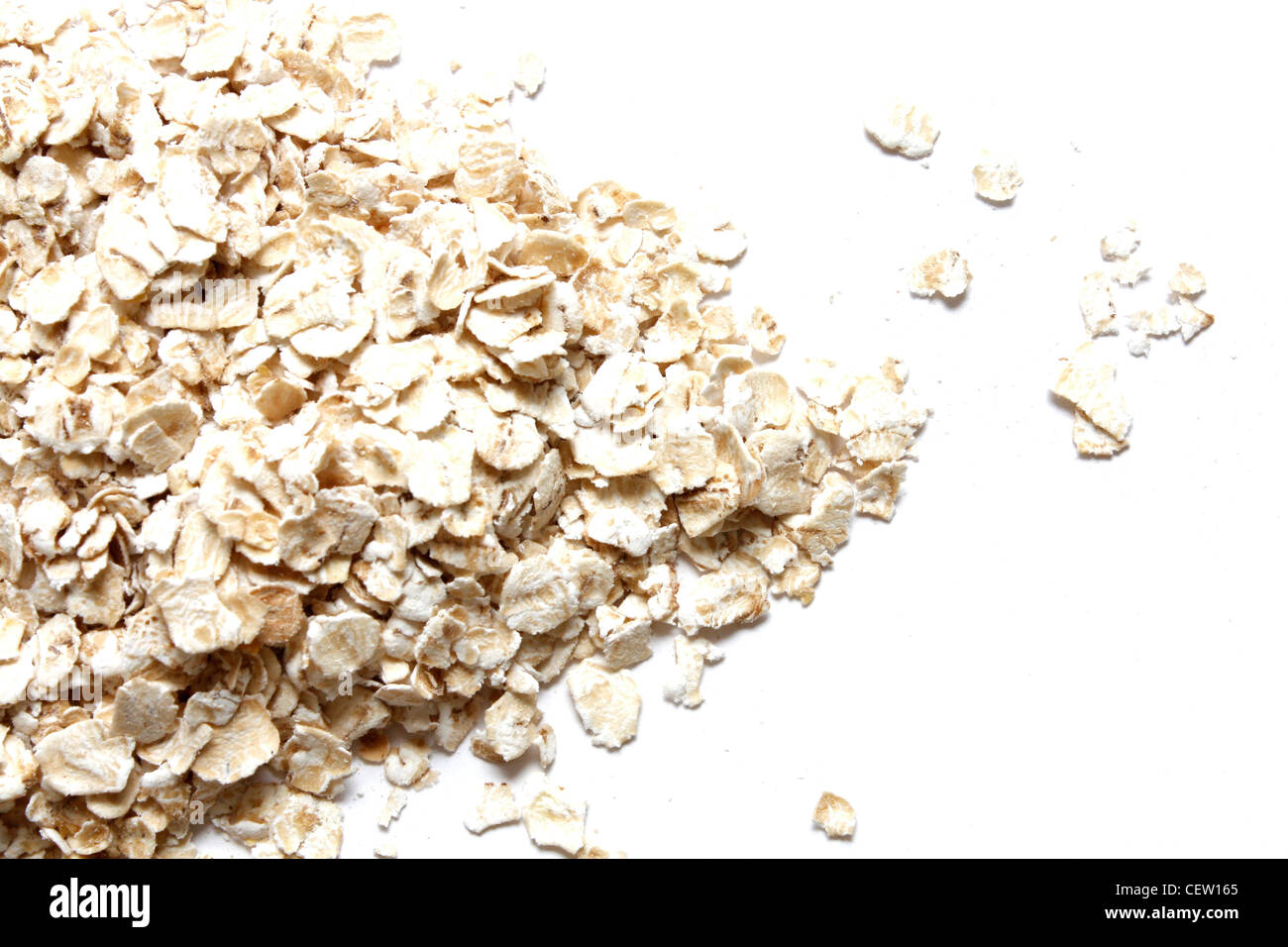 Oats in a heap isolated on white Stock Photo - Alamy