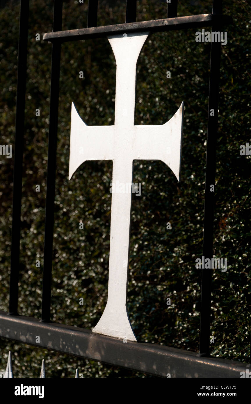 Christian cross on the gate to church grounds Stock Photo - Alamy