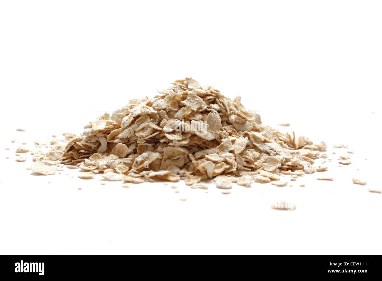 Oats in a heap isolated on white Stock Photo - Alamy