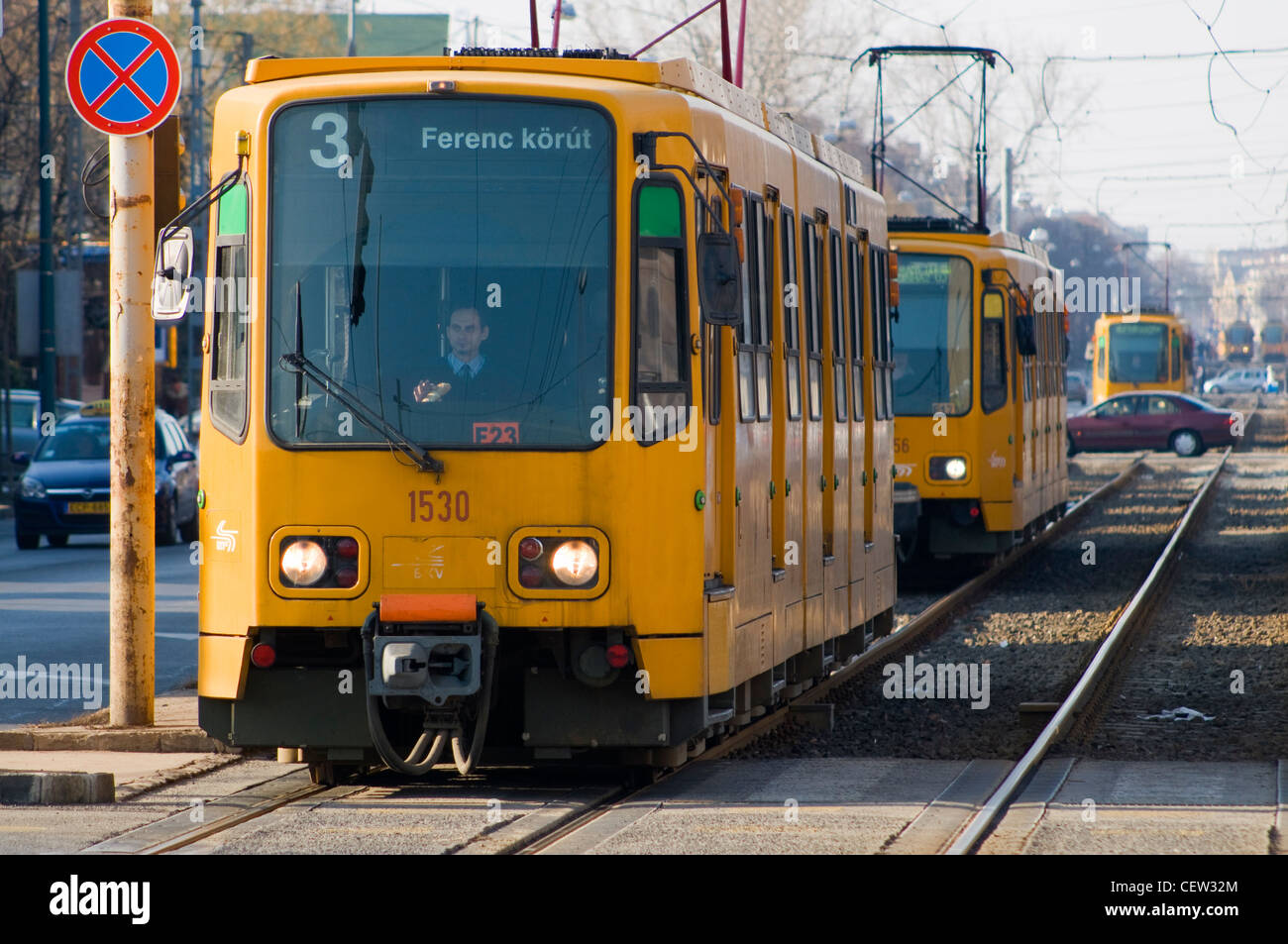 Three trams in a line with traffic crossing. Budapest Stock Photo - Alamy