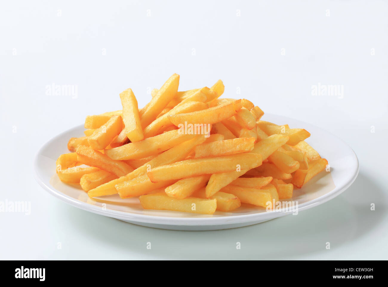 Serving of French fries on a plate Stock Photo - Alamy