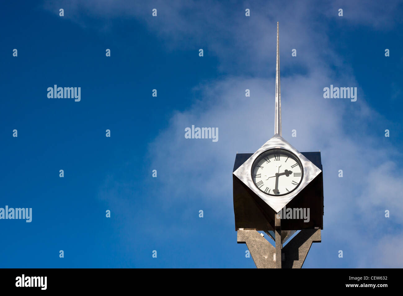 Photo of clock and blue sky Stock Photo - Alamy