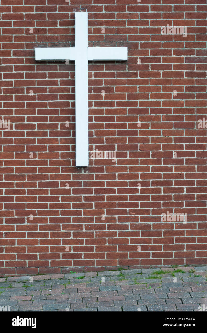 Christian cross on brick wall of a church Stock Photo - Alamy