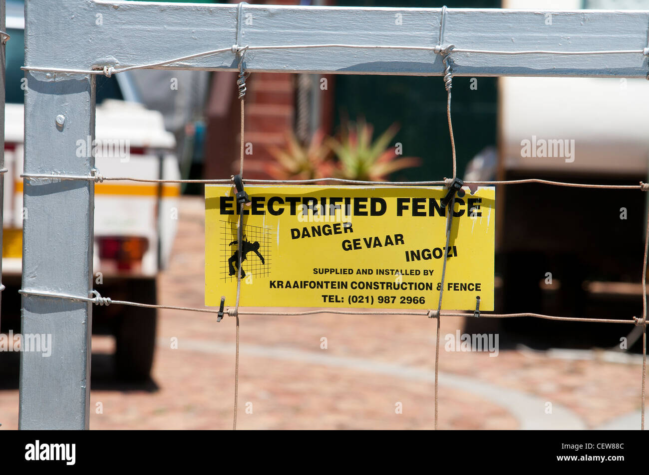 Warning sign on Electric fence Stock Photo - Alamy