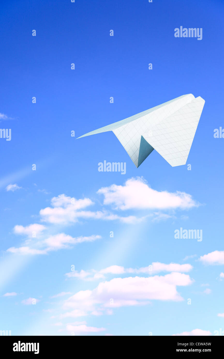 Paper plane flying. Sky and clouds in the background Stock Photo - Alamy
