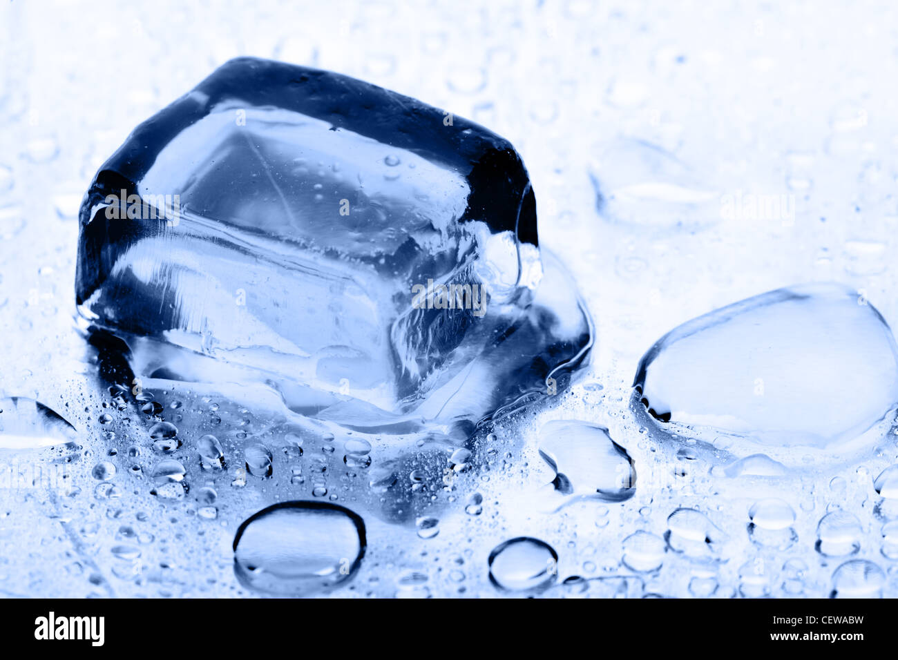 Ice cube and water drops close up Stock Photo - Alamy
