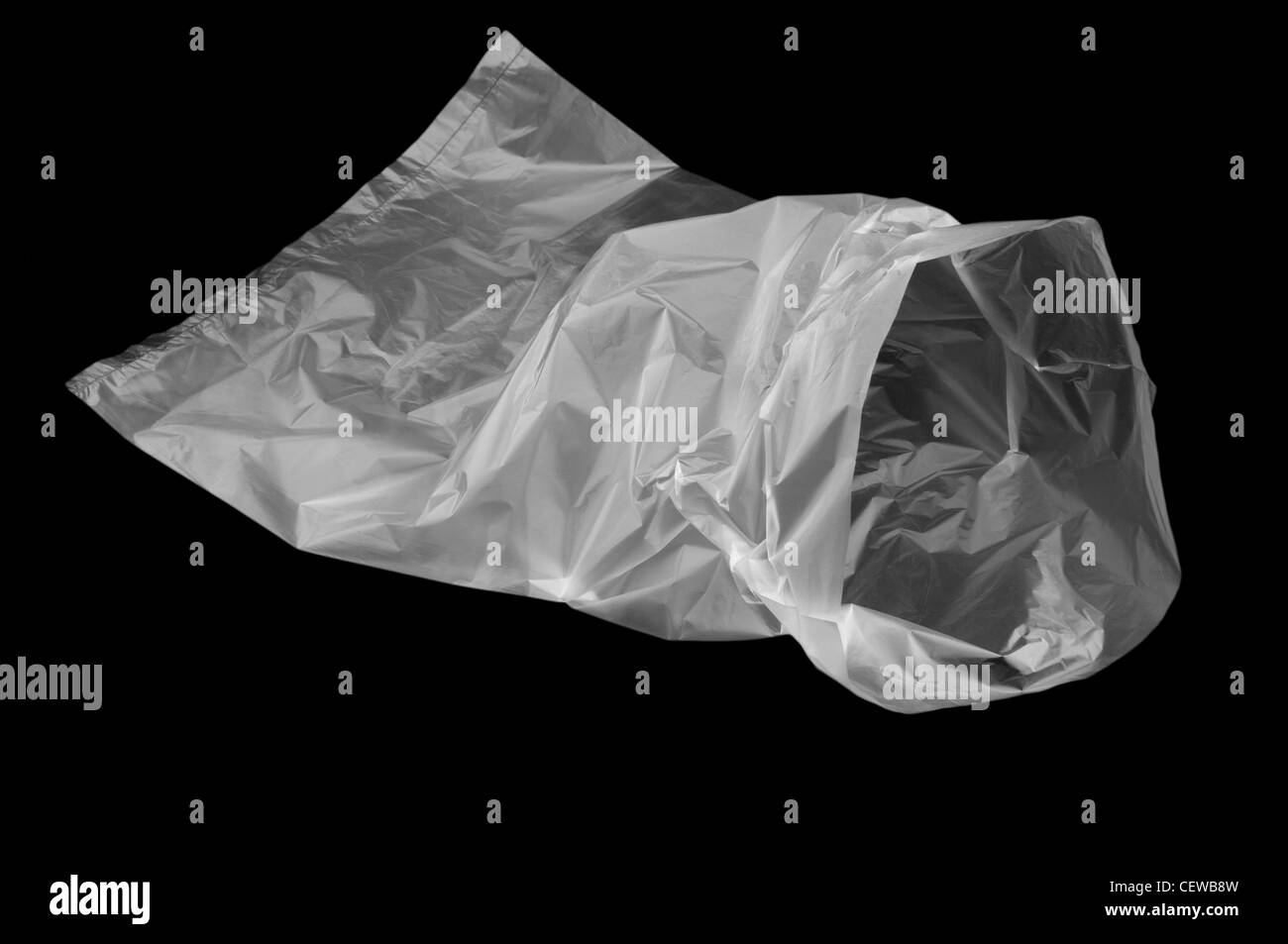 open plastic bag to store empty on a black background Stock Photo - Alamy