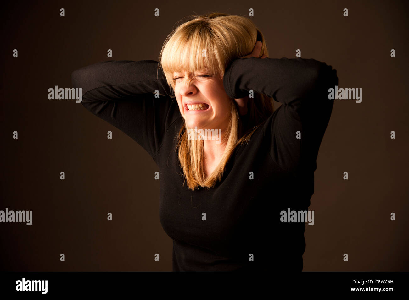Hands over ears hi-res stock photography and images - Alamy