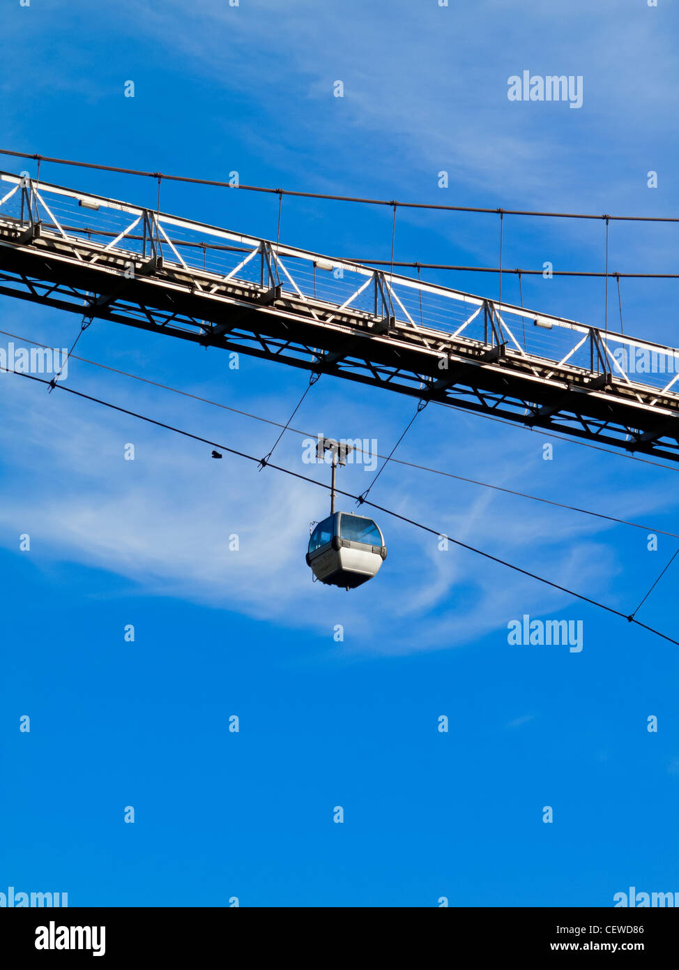 Suspension bridge and cable car over a valley in Morzine in the Haute ...