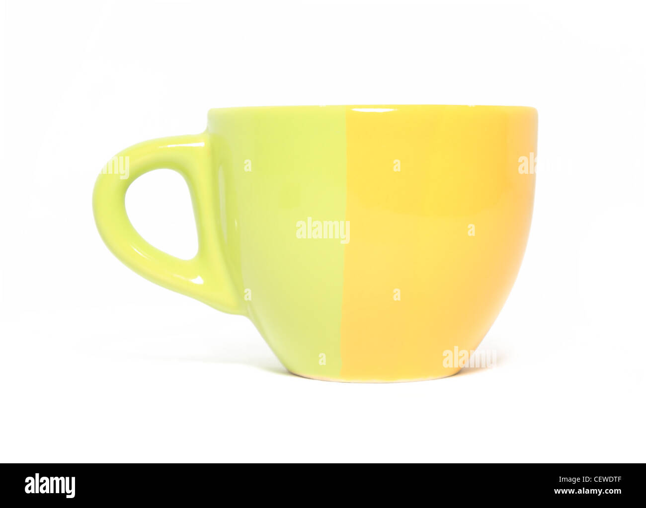 yellow cup on white background Stock Photo - Alamy