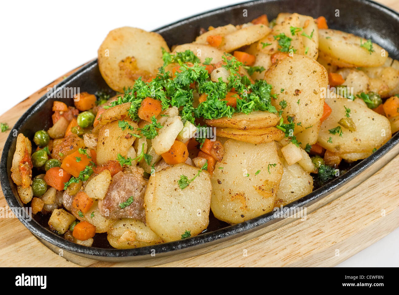 Fried potato with meat and vegetables on a white Stock Photo - Alamy
