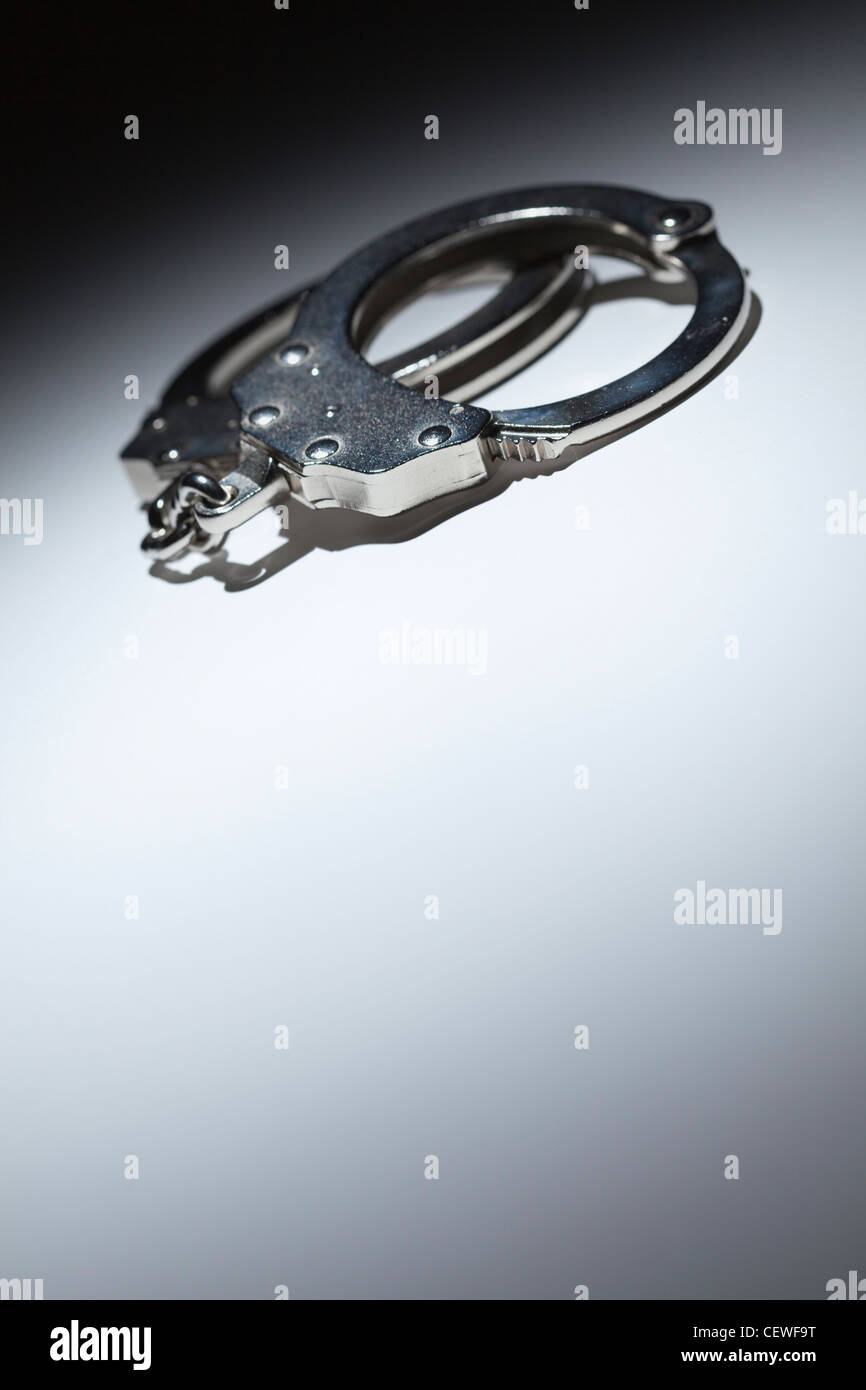 Jail cuffs hi-res stock photography and images - Alamy