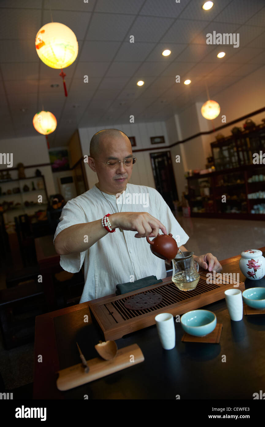A man prepares green tea during a traditional tea ceremony Stock Photo ...