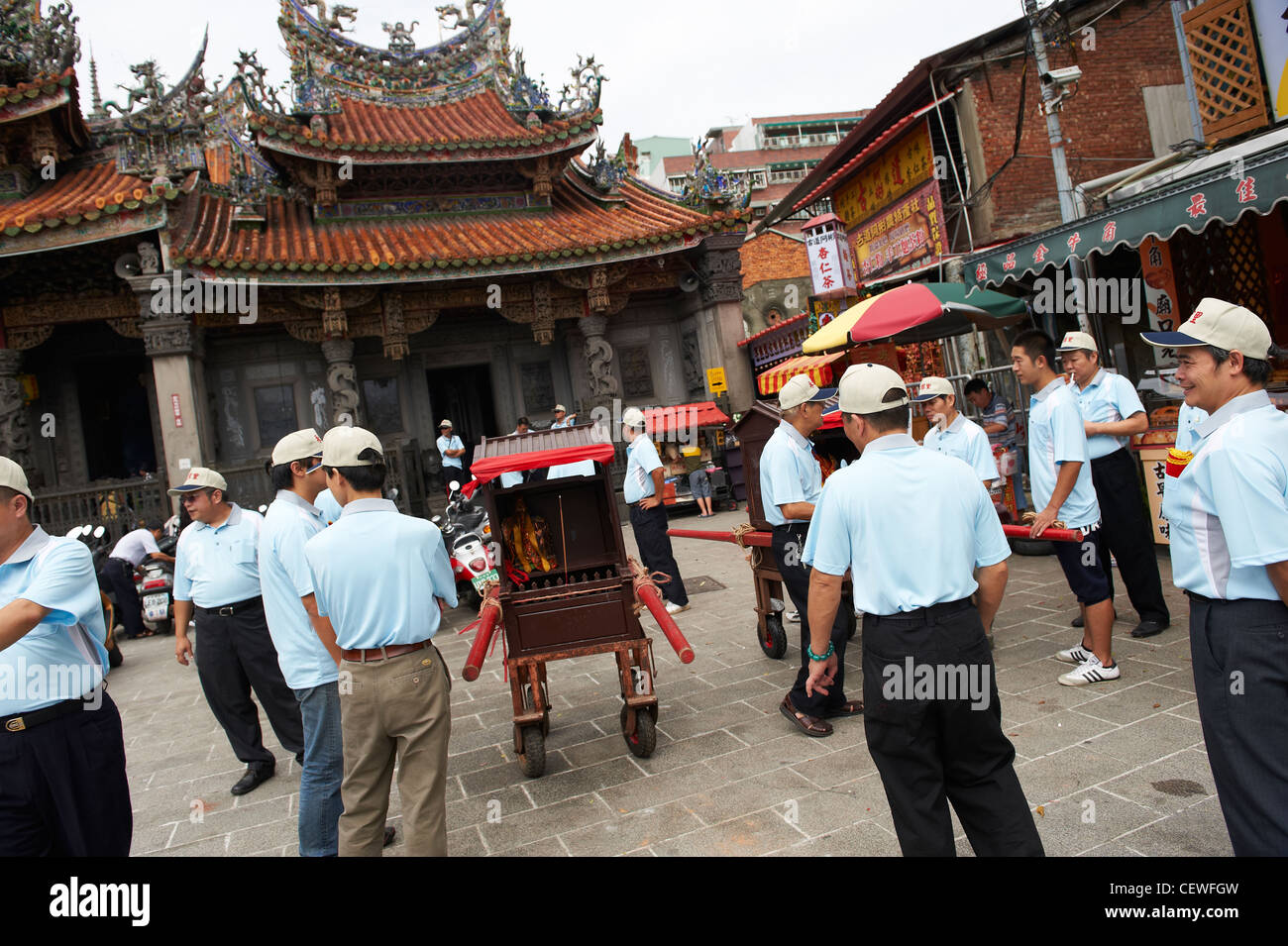 A proccesion passing in front of the Zushi Daoist Temple and through ...