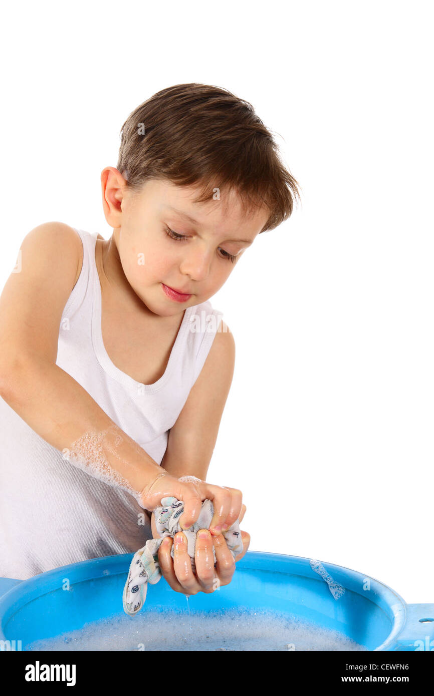 The little boy helps mother, erasing clothes Stock Photo - Alamy