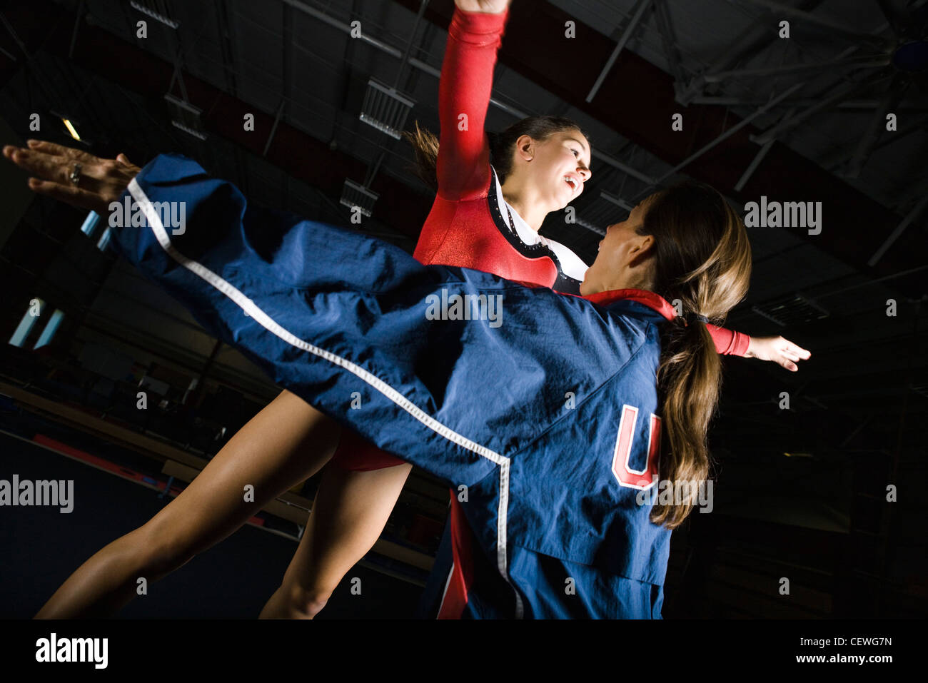 Female gymnast training with coach Stock Photo - Alamy