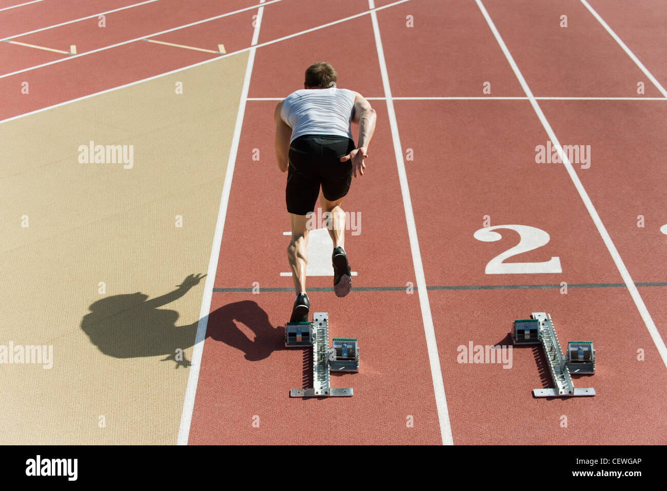 Runner at starting line, rear view Stock Photo - Alamy Runner at starting line, rear view Stock Photo - Alamy